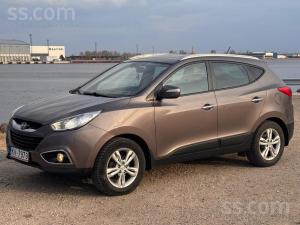 Brown Hyundai ix35 2012 in Riga, with an engine capacity of 2.00 L and mileage of 147 thousand km for 7250 €, photo 6 on AUTOMOTO.COM.LV