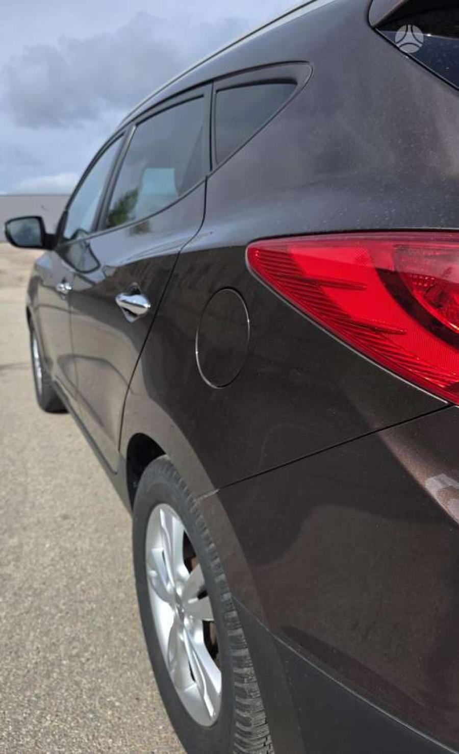 Brown Hyundai ix35 2013 in Rokiskis, with an engine capacity of 2.00 L and mileage of 237 thousand km for 5400 €, photo 7 on AUTOMOTO.COM.LV
