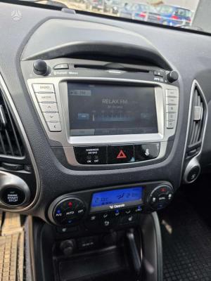 Brown Hyundai ix35 2013 in Rokiskis, with an engine capacity of 2.00 L and mileage of 237 thousand km for 5400 €, photo 20 on AUTOMOTO.COM.LV