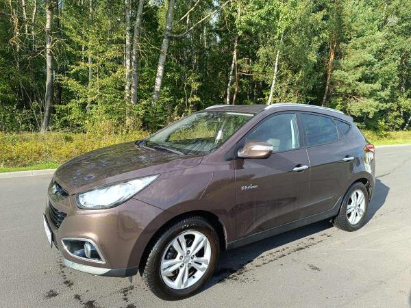 Brown Hyundai ix35 2011 in Kaunas, with an engine capacity of 1.60 L and mileage of 207 thousand km for 6600 €, photo 7 on AUTOMOTO.COM.LV