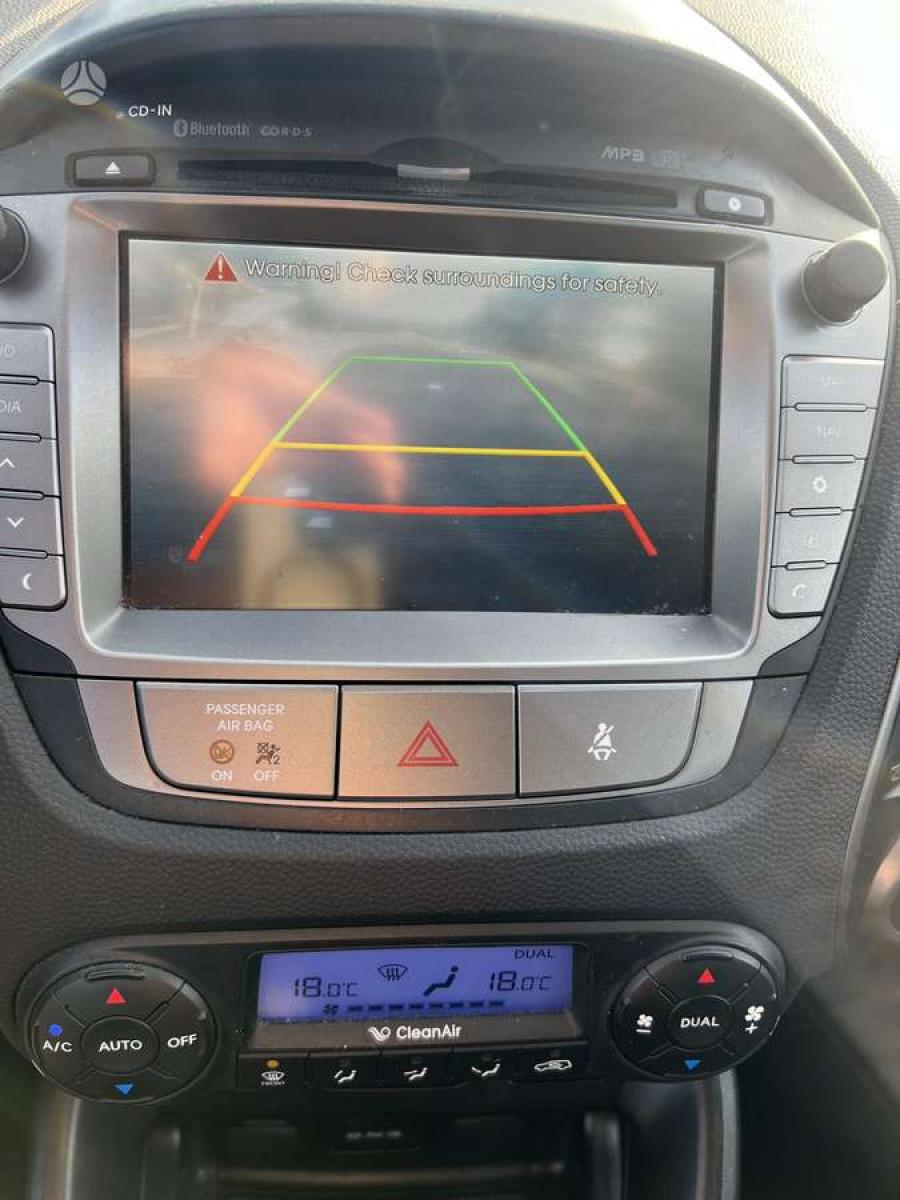 Grey Hyundai ix35 2013 in Panevezys, with an engine capacity of 1.69 L and mileage of 194 thousand km for 5300 €, photo 12 on AUTOMOTO.COM.LV