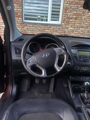 Orange Hyundai ix35 2013 in Vilnius, with an engine capacity of 1.59 L and mileage of 187 thousand km for 6990 €, photo 6 on AUTOMOTO.COM.LV