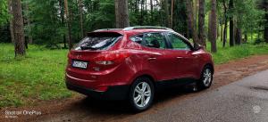 Red Hyundai ix35 2011 in Vilnius, with an engine capacity of 2.00 L and mileage of 114 thousand km for 6800 €, photo 4 on AUTOMOTO.COM.LV