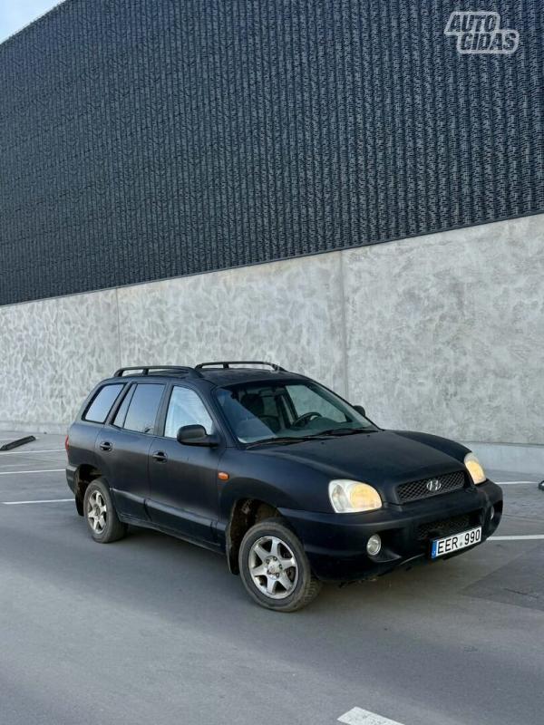 Melns Hyundai Santa Fe 2001 Viļņa, ar dzinēja tilpumu 2.00 L un nobraukumu 266 tūkst. km par 800 €, foto 1 vietnē AUTOMOTO.COM.LV