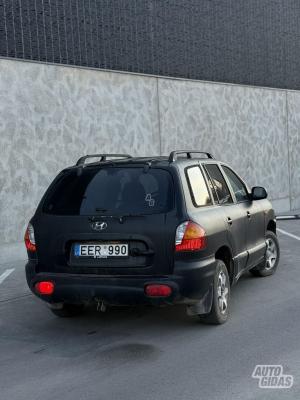 Melns Hyundai Santa Fe 2001 Viļņa, ar dzinēja tilpumu 2.00 L un nobraukumu 266 tūkst. km par 800 €, foto 4 vietnē AUTOMOTO.COM.LV