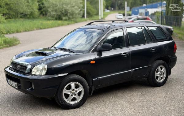 Melns Hyundai Santa Fe 2001 Viļņa, ar dzinēja tilpumu 2.00 L un nobraukumu 272 tūkst. km par 1450 €, foto 2 vietnē AUTOMOTO.COM.LV
