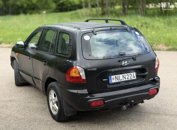 Melns Hyundai Santa Fe 2001 Viļņa, ar dzinēja tilpumu 2.00 L un nobraukumu 272 tūkst. km par 1450 €, foto 3 vietnē AUTOMOTO.COM.LV