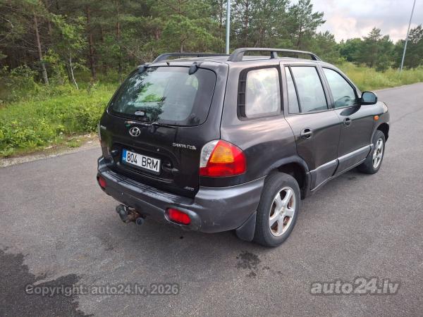 Black Hyundai Santa Fe 2002 in Tallinn, with an engine capacity of 2.40 L and mileage of 0 thousand km for 1200 €, photo 3 on AUTOMOTO.COM.LV