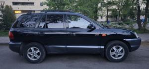 Black Hyundai Santa Fe 2003 in Vilnius, with an engine capacity of 2.00 L and mileage of 197 thousand km for 2800 €, photo 3 on AUTOMOTO.COM.LV