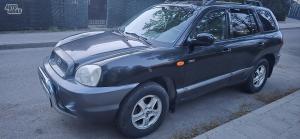 Black Hyundai Santa Fe 2003 in Vilnius, with an engine capacity of 2.00 L and mileage of 197 thousand km for 2800 €, photo 9 on AUTOMOTO.COM.LV