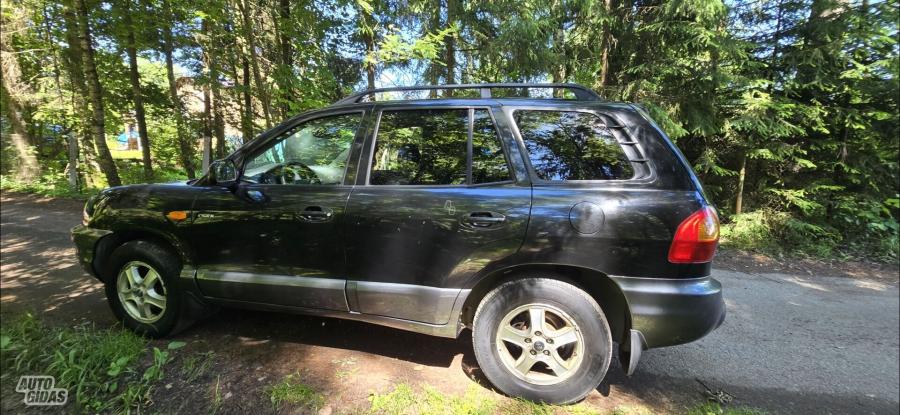 Melns Hyundai Santa Fe 2003 Viļņa, ar dzinēja tilpumu 2.00 L un nobraukumu 198 tūkst. km par 2000 €, foto 7 vietnē AUTOMOTO.COM.LV