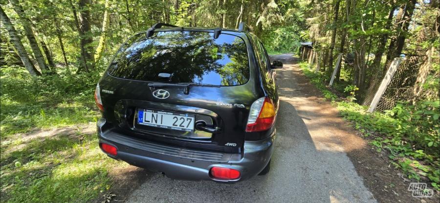 Melns Hyundai Santa Fe 2003 Viļņa, ar dzinēja tilpumu 2.00 L un nobraukumu 198 tūkst. km par 2000 €, foto 9 vietnē AUTOMOTO.COM.LV