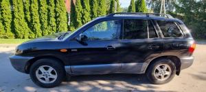 Black Hyundai Santa Fe 2003 in Vilnius, with an engine capacity of 1.99 L and mileage of 198 thousand km for 1800 €, photo 5 on AUTOMOTO.COM.LV