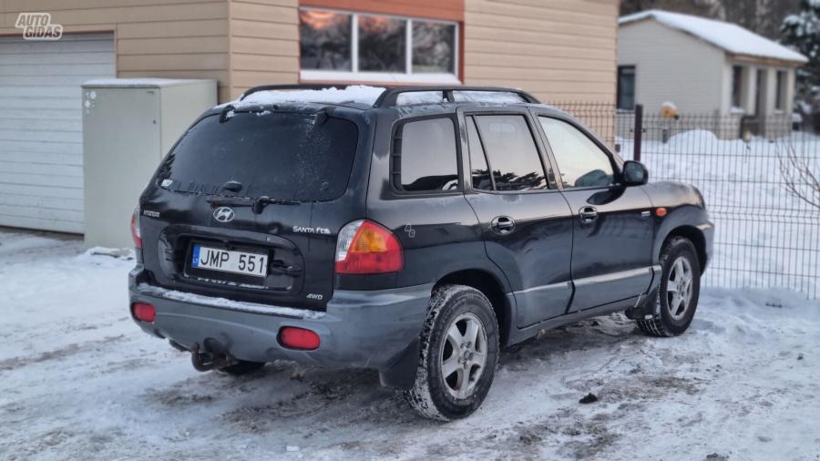 Black Hyundai Santa Fe 2004 in Vilnius, with an engine capacity of 2.00 L and mileage of 419 thousand km for 1650 €, photo 3 on AUTOMOTO.COM.LV