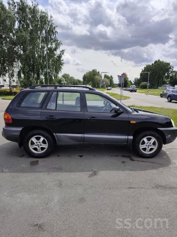 Melns Hyundai Santa Fe 2004 Rīga, ar dzinēja tilpumu 2.40 L un nobraukumu 0 tūkst. km par 950 €, foto 2 vietnē AUTOMOTO.COM.LV
