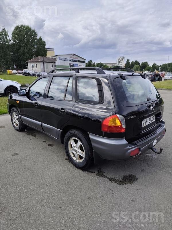 Melns Hyundai Santa Fe 2004 Rīga, ar dzinēja tilpumu 2.40 L un nobraukumu 0 tūkst. km par 950 €, foto 4 vietnē AUTOMOTO.COM.LV