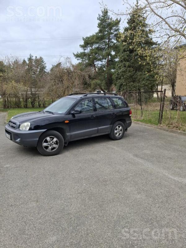Melns Hyundai Santa Fe 2006 Rīga, ar dzinēja tilpumu 2.70 L un nobraukumu 328 tūkst. km par 2500 €, foto 1 vietnē AUTOMOTO.COM.LV