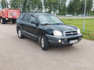 Black Hyundai Santa Fe 2006 in Riga, with an engine capacity of 2.40 L and mileage of 352 thousand km for 1600 €, photo 3 on AUTOMOTO.COM.LV