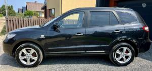 Black Hyundai Santa Fe 2007 in Marijampole, with an engine capacity of 2.19 L and mileage of 245 thousand km for 4490 €, photo 6 on AUTOMOTO.COM.LV