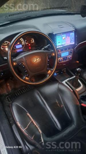 Black Hyundai Santa Fe 2008 in Riga, with an engine capacity of 2.20 L and mileage of 270 thousand km for 2000 €, photo 7 on AUTOMOTO.COM.LV