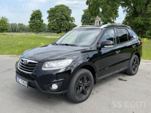 Black Hyundai Santa Fe 2011 in Riga, with an engine capacity of 2.20 L and mileage of 0 thousand km for 5950 €, photo  on AUTOMOTO.COM.LV