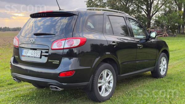 Melns Hyundai Santa Fe 2011 Rīga, ar dzinēja tilpumu 2.20 L un nobraukumu 315 tūkst. km par 4900 €, foto 6 vietnē AUTOMOTO.COM.LV