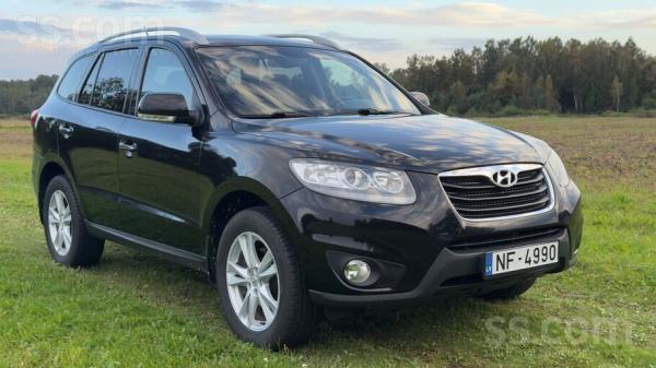 Melns Hyundai Santa Fe 2011 Rīga, ar dzinēja tilpumu 2.20 L un nobraukumu 315 tūkst. km par 4900 €, foto 8 vietnē AUTOMOTO.COM.LV