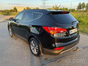Melns Hyundai Santa Fe 2012 Rīga, ar dzinēja tilpumu 2.20 L un nobraukumu 220 tūkst. km par 12000 €, foto 5 vietnē AUTOMOTO.COM.LV