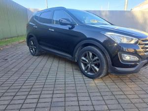 Black Hyundai Santa Fe 2013 in Marijampole, with an engine capacity of 2.20 L and mileage of 169 thousand km for 10500 €, photo 2 on AUTOMOTO.COM.LV