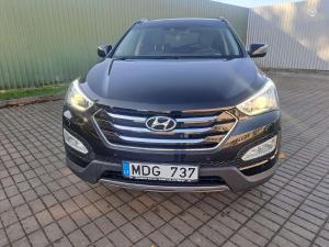 Black Hyundai Santa Fe 2013 in Marijampole, with an engine capacity of 2.20 L and mileage of 169 thousand km for 10500 €, photo 5 on AUTOMOTO.COM.LV