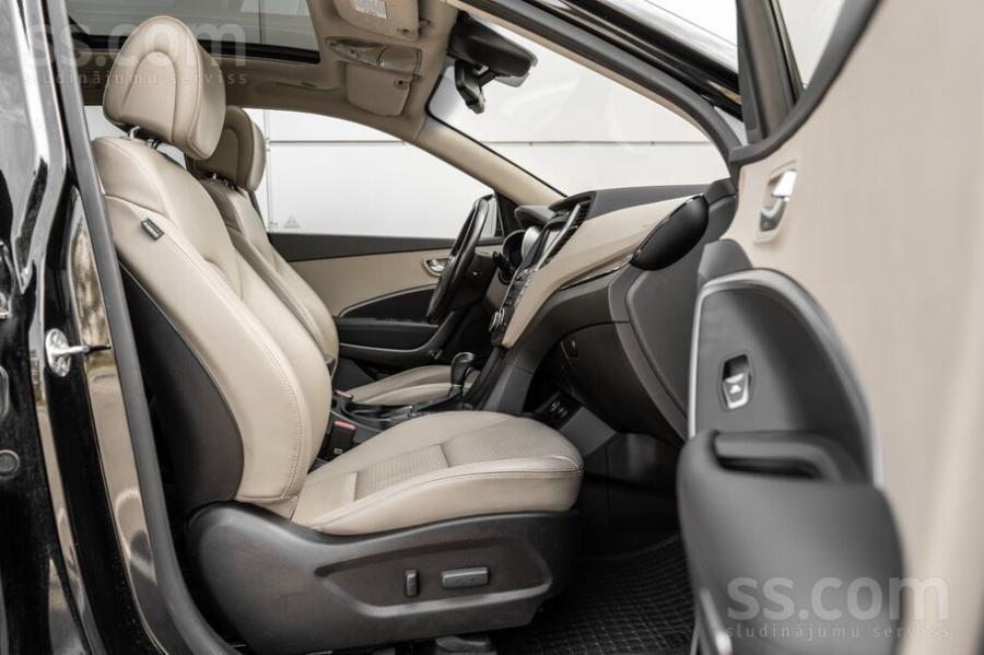 Black Hyundai Santa Fe 2013 in Riga, with an engine capacity of 2.20 L and mileage of 245 thousand km for 10990 €, photo 11 on AUTOMOTO.COM.LV