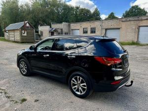 Melns Hyundai Santa Fe 2013 Biržai, ar dzinēja tilpumu 2.20 L un nobraukumu 259 tūkst. km par 8900 €, foto 12 vietnē AUTOMOTO.COM.LV