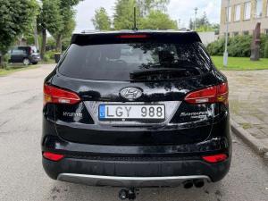 Black Hyundai Santa Fe 2014 in Mazeikiai, with an engine capacity of 2.20 L and mileage of 220 thousand km for 7300 €, photo 5 on AUTOMOTO.COM.LV