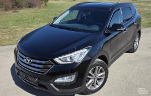 Black Hyundai Santa Fe 2015 in Siauliai, with an engine capacity of 2.00 L and mileage of 194 thousand km for 10650 €, photo 6 on AUTOMOTO.COM.LV