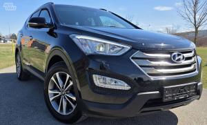 Black Hyundai Santa Fe 2015 in Siauliai, with an engine capacity of 2.00 L and mileage of 194 thousand km for 10650 €, photo 11 on AUTOMOTO.COM.LV
