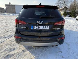 Black Hyundai Santa Fe 2017 in Kaunas, with an engine capacity of 2.20 L and mileage of 187 thousand km for 15500 €, photo 5 on AUTOMOTO.COM.LV