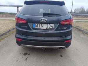 Blue Hyundai Santa Fe 2013 in Visaginas, with an engine capacity of 2.20 L and mileage of 230 thousand km for 10700 €, photo 6 on AUTOMOTO.COM.LV