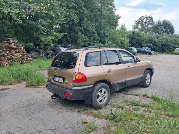 Brūns Hyundai Santa Fe 2002 Madona, ar dzinēja tilpumu 2.40 L un nobraukumu 336 tūkst. km par 1500 €, foto 4 vietnē AUTOMOTO.COM.LV