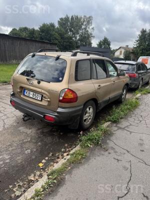 Brown Hyundai Santa Fe 2002 in Riga, with an engine capacity of 2.40 L and mileage of 347 thousand km for 1250 €, photo 5 on AUTOMOTO.COM.LV