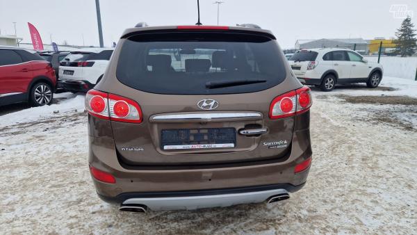 Brūns Hyundai Santa Fe 2011 Marijampole, ar dzinēja tilpumu 2.20 L un nobraukumu 242 tūkst. km par 7690 €, foto 6 vietnē AUTOMOTO.COM.LV