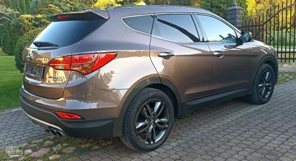 Brūns Hyundai Santa Fe 2013 Tauragė, ar dzinēja tilpumu 2.20 L un nobraukumu 231 tūkst. km par 10800 €, foto 5 vietnē AUTOMOTO.COM.LV