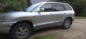 Pelēks Hyundai Santa Fe 2001 Madona, ar dzinēja tilpumu 2.40 L un nobraukumu 530 tūkst. km par 1000 €, foto  vietnē AUTOMOTO.COM.LV