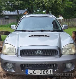Pelēks Hyundai Santa Fe 2002 Ogre, ar dzinēja tilpumu 2.00 L un nobraukumu 300 tūkst. km par 850 €, foto  vietnē AUTOMOTO.COM.LV