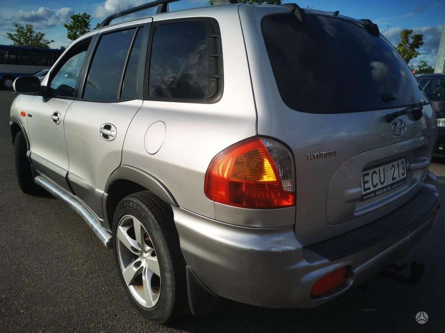 Grey Hyundai Santa Fe 2004 in Vilnius, with an engine capacity of 1.99 L and mileage of 274 thousand km for 2690 €, photo 12 on AUTOMOTO.COM.LV