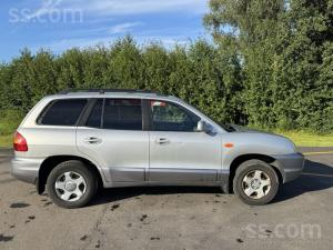 Pelēks Hyundai Santa Fe 2005 Rīga, ar dzinēja tilpumu 2.40 L un nobraukumu 282 tūkst. km par 2300 €, foto 5 vietnē AUTOMOTO.COM.LV