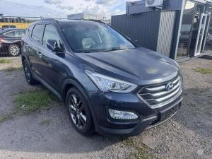 Grey Hyundai Santa Fe 2013 in Kaunas, with an engine capacity of 2.19 L and mileage of 257 thousand km for 8600 €, photo 3 on AUTOMOTO.COM.LV