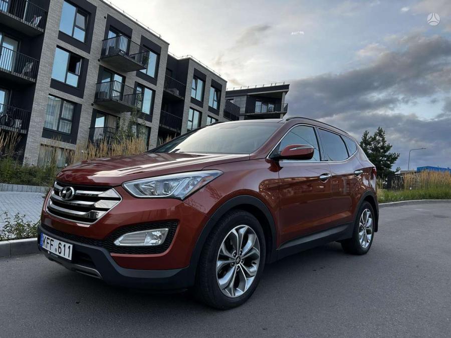 Orange Hyundai Santa Fe 2015 in Vilnius, with an engine capacity of 2.00 L and mileage of 100 thousand km for 12999 €, photo 1 on AUTOMOTO.COM.LV