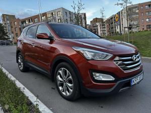 Orange Hyundai Santa Fe 2015 in Vilnius, with an engine capacity of 2.00 L and mileage of 100 thousand km for 12999 €, photo 3 on AUTOMOTO.COM.LV