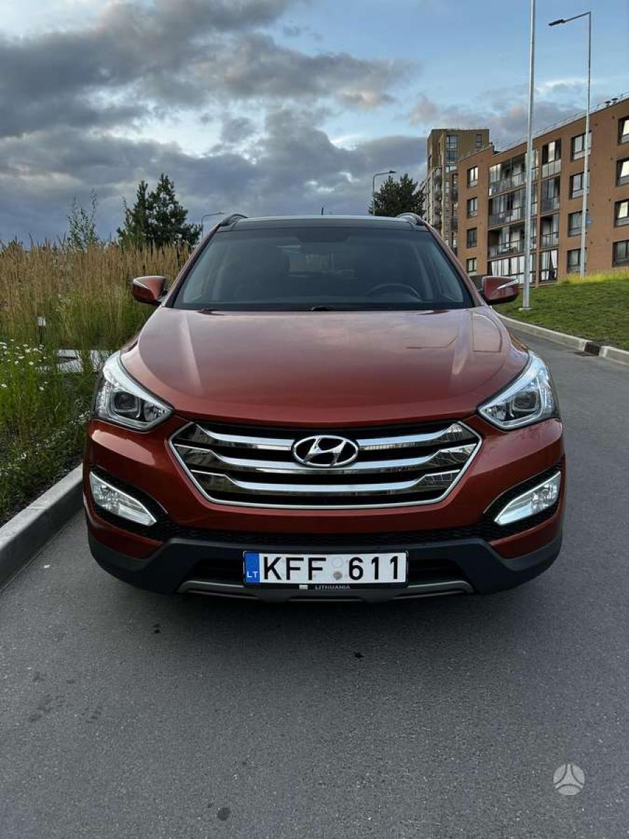 Orange Hyundai Santa Fe 2015 in Vilnius, with an engine capacity of 2.00 L and mileage of 100 thousand km for 12999 €, photo 4 on AUTOMOTO.COM.LV