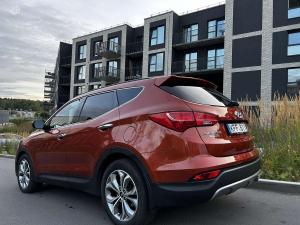 Orange Hyundai Santa Fe 2015 in Vilnius, with an engine capacity of 2.00 L and mileage of 100 thousand km for 12999 €, photo 5 on AUTOMOTO.COM.LV